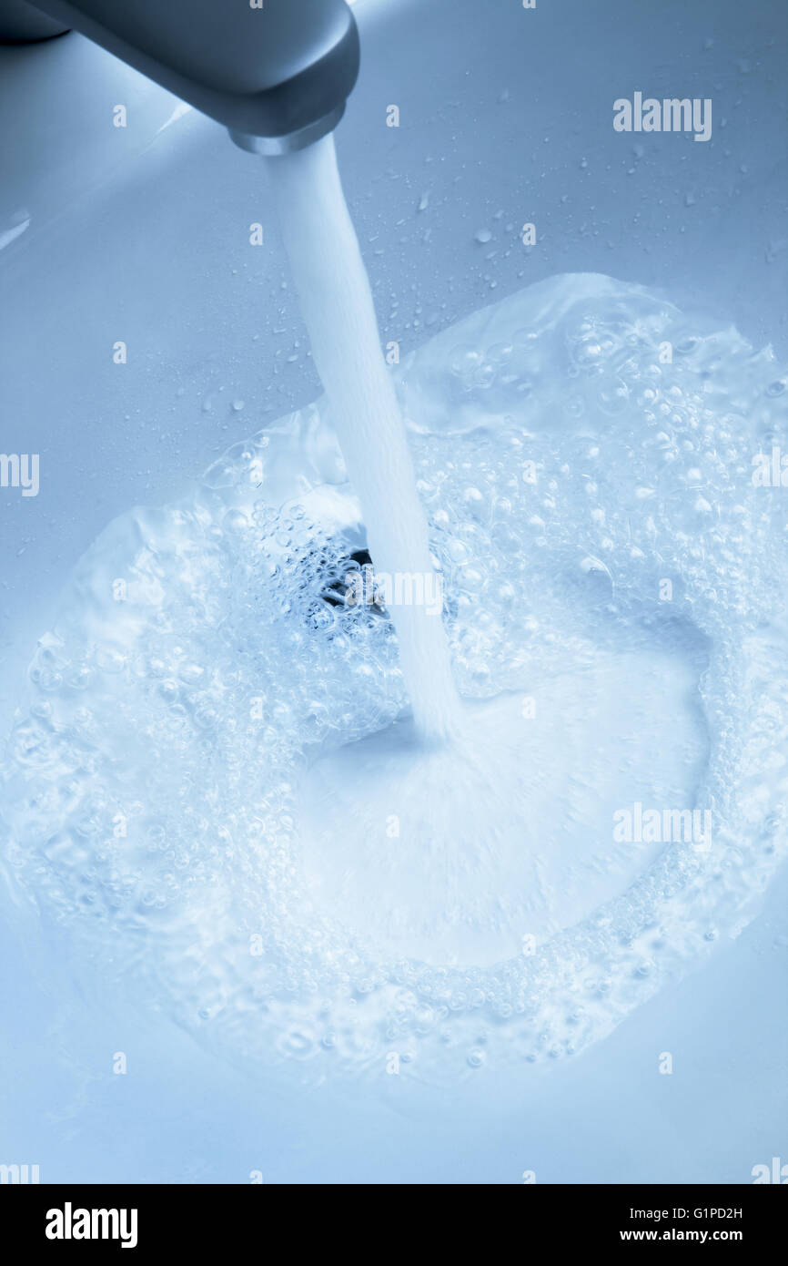Stream and drops of pure water in a sink Stock Photo - Alamy