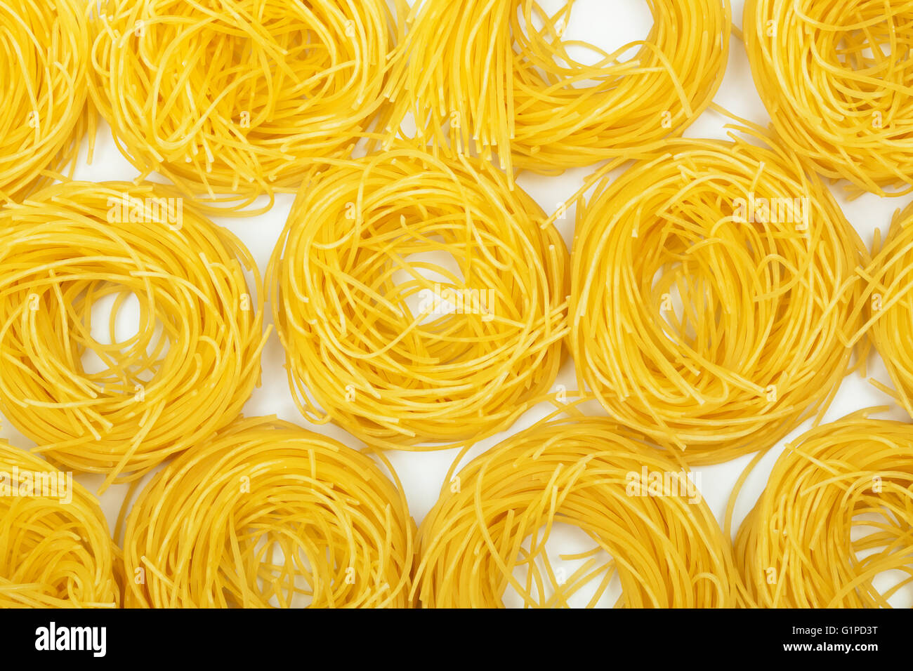 Yellow and beautiful pasta close-up as a background Stock Photo - Alamy