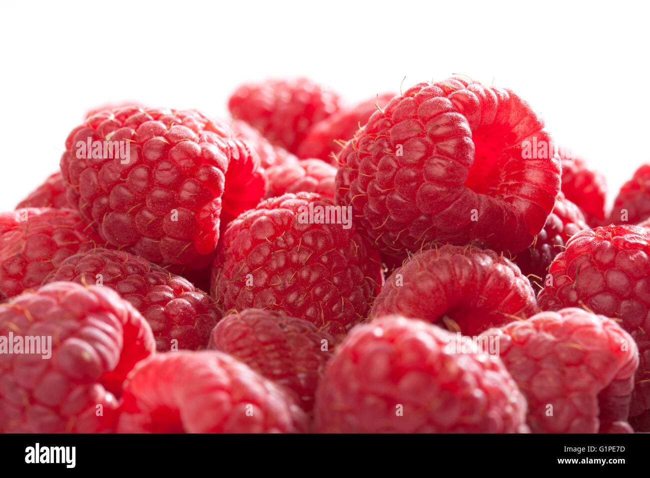 Closeup to fresh red raspberries , isolated on white background Stock ...