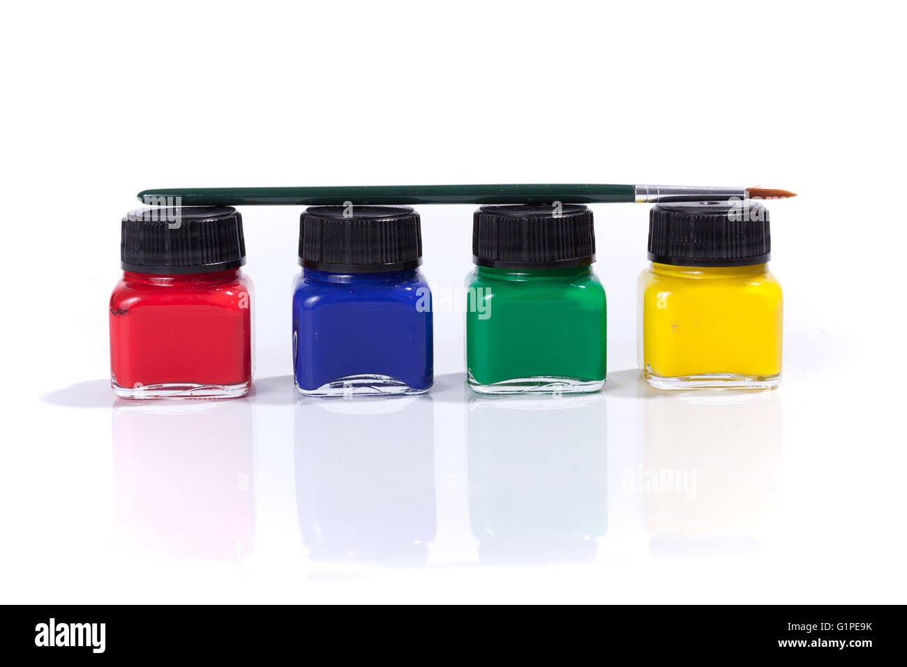 Four paint bottles in prime colors, isolated on white background Stock ...