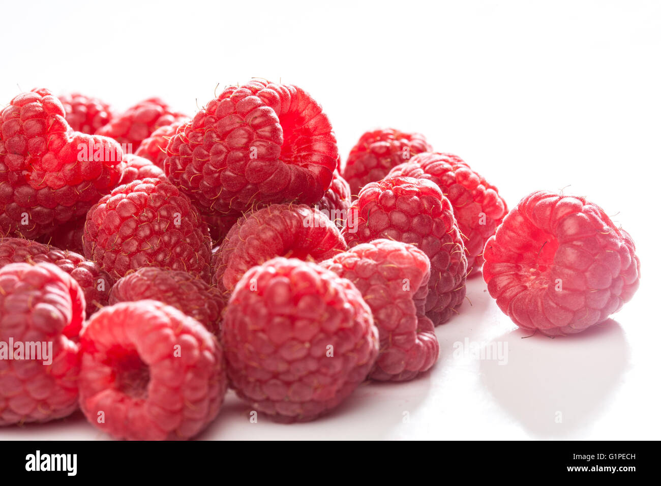 Closeup to fresh red raspberries , isolated on white background Stock ...