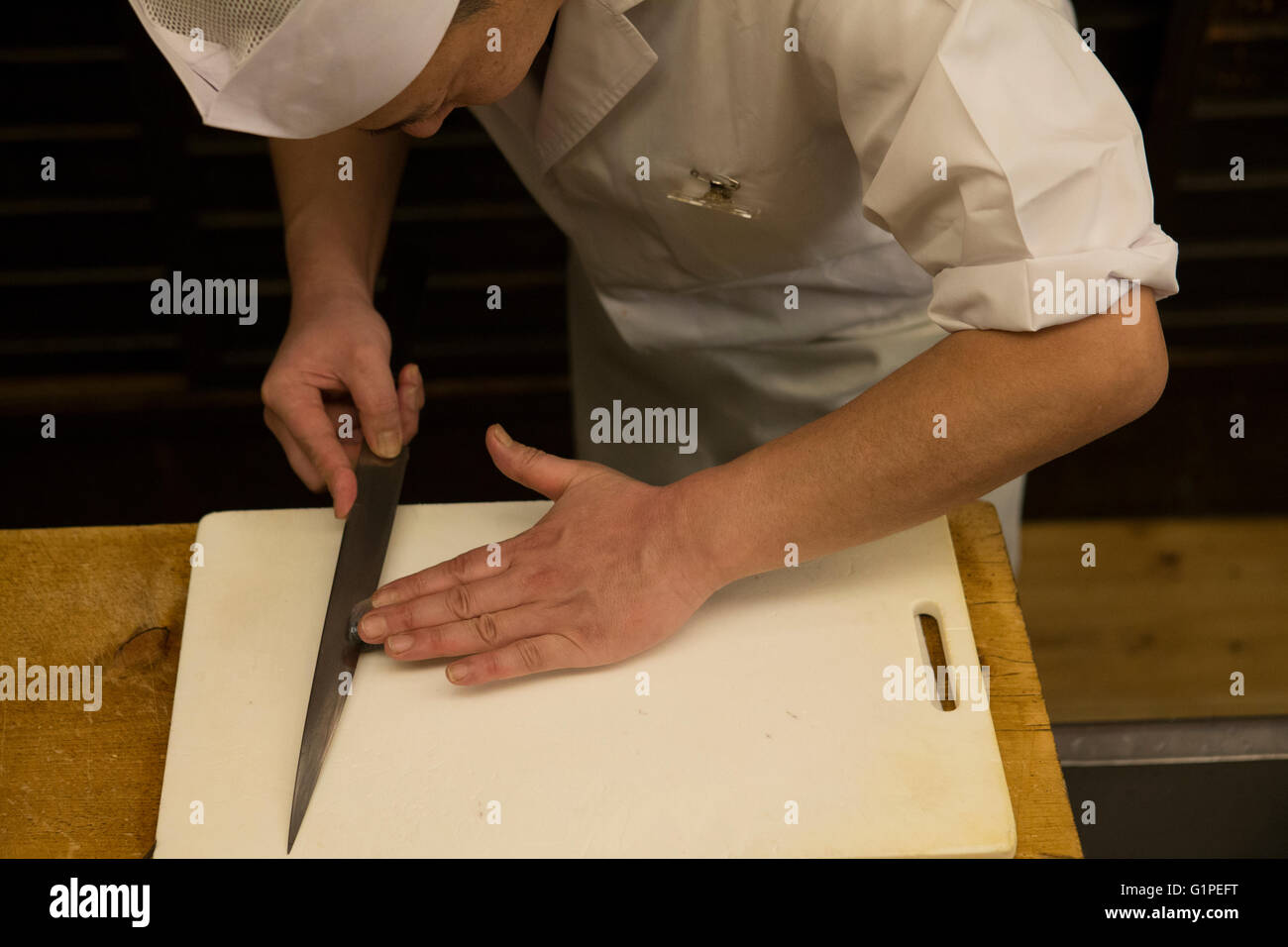 Japanese cook preparing fish Stock Photo - Alamy