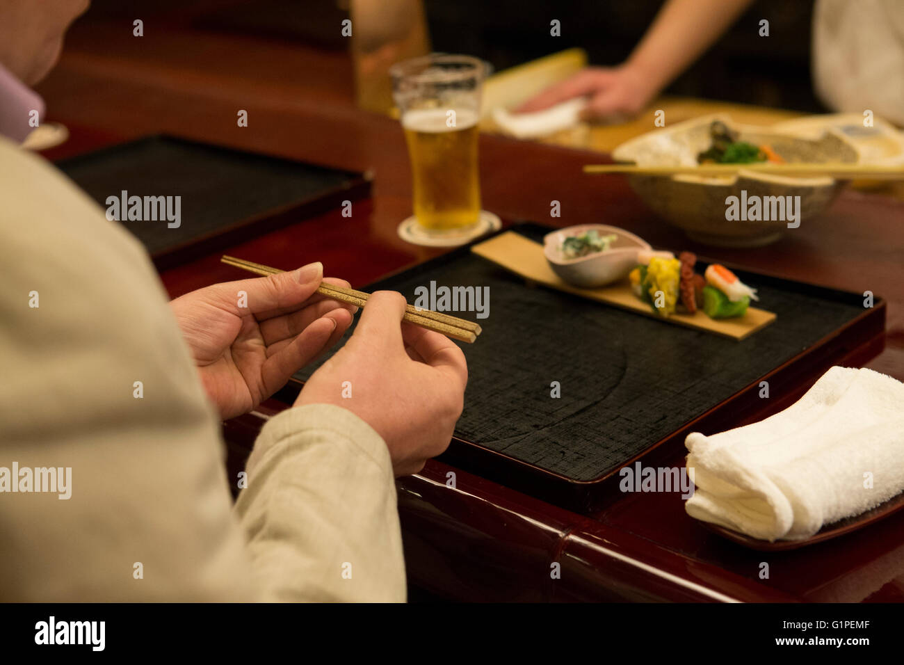 Holding chopsticks hi-res stock photography and images - Alamy