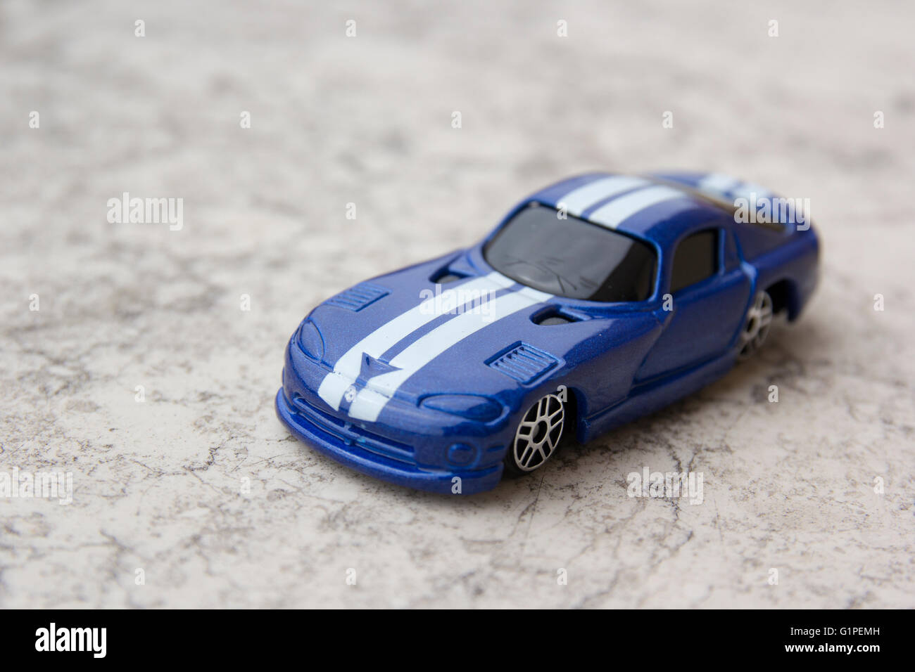 Blue toy car hi-res stock photography and images - Alamy