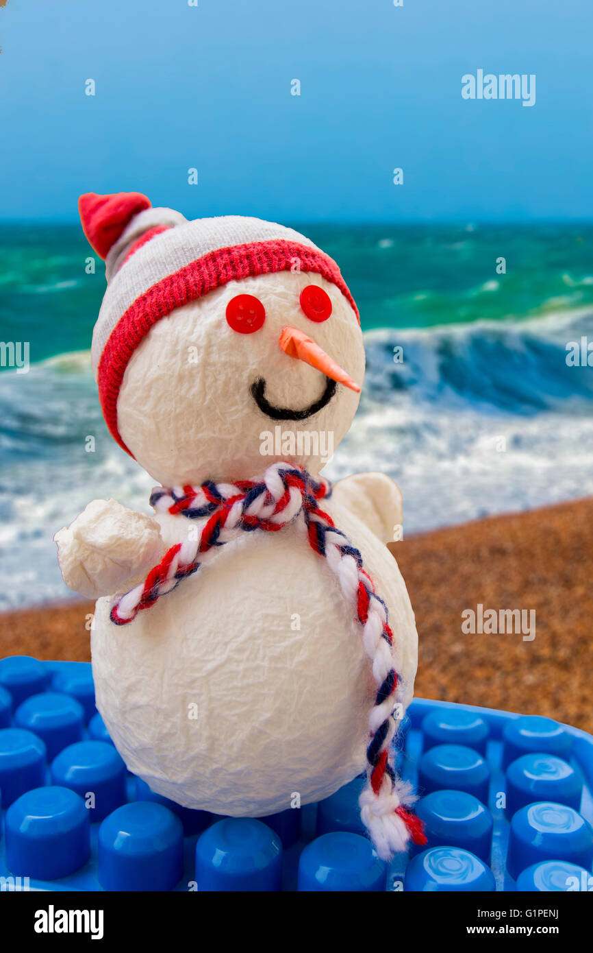 Snowman with beach and sea in the background Stock Photo - Alamy