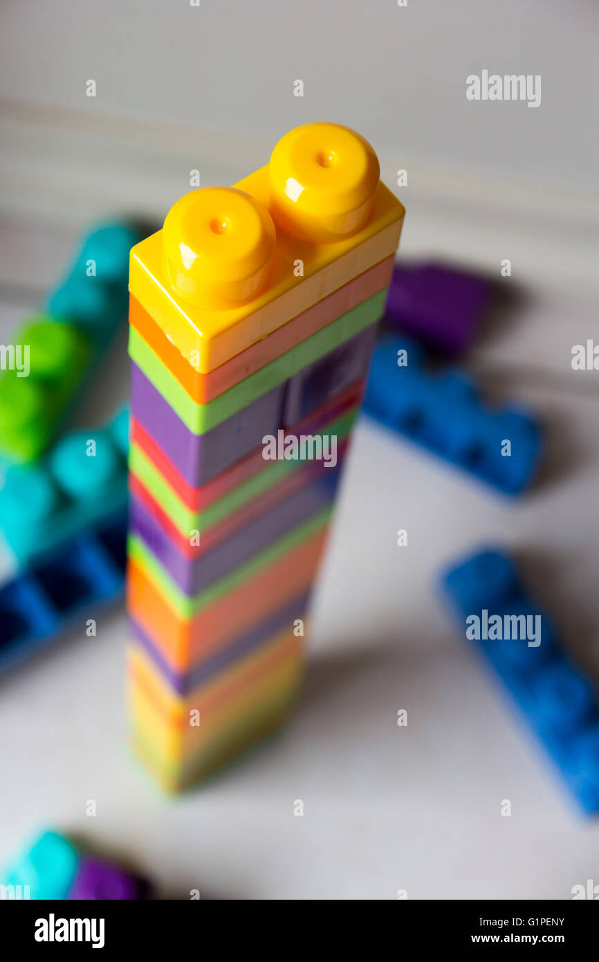 Colored tower, built with toy blocks Stock Photo - Alamy