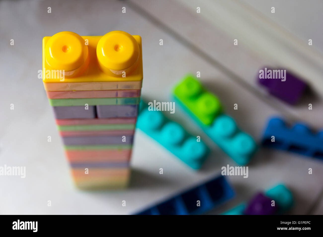 Colored tower, built with toy blocks Stock Photo - Alamy