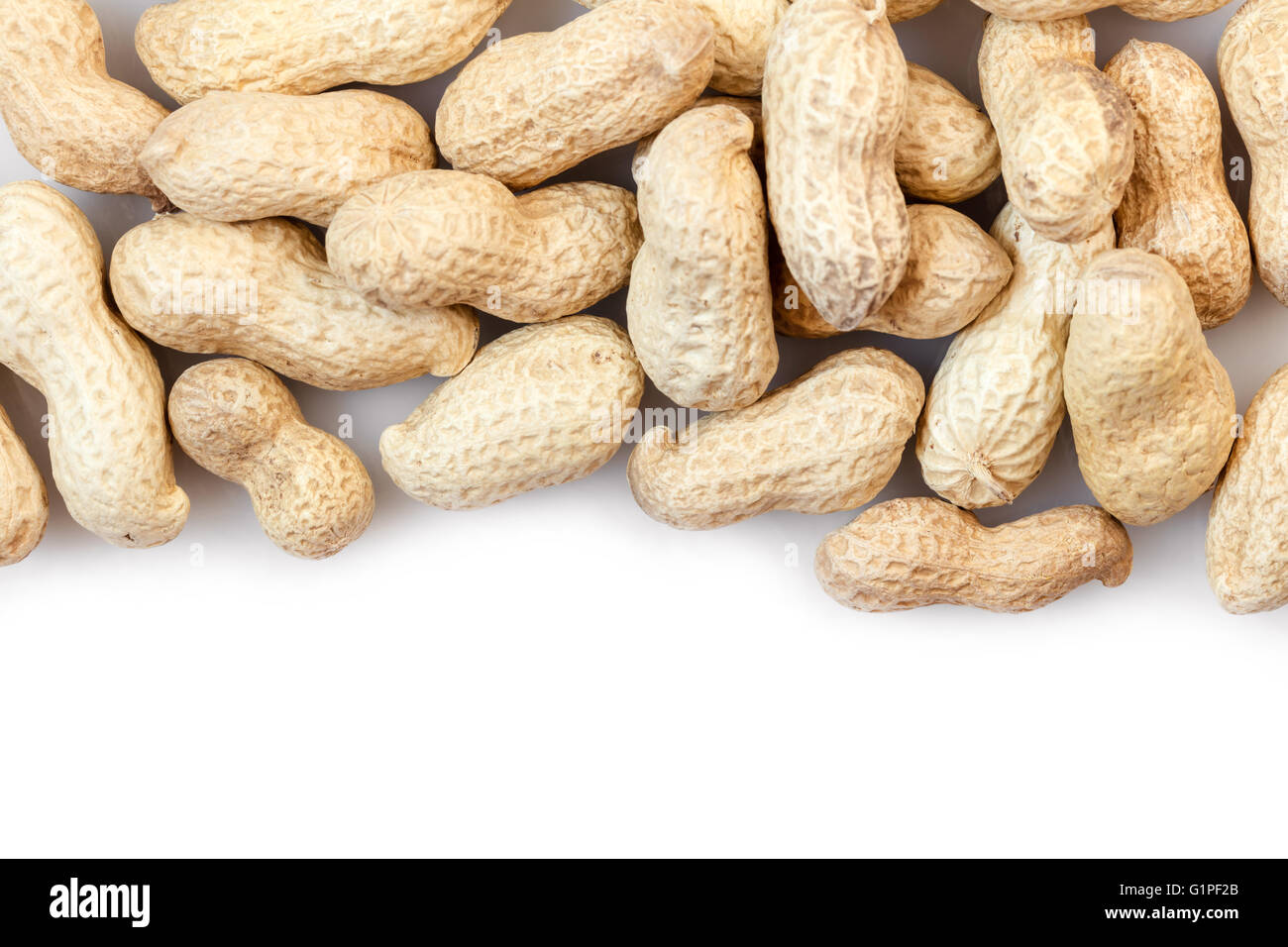 groundnut in the skin close-up on a white background Stock Photo - Alamy