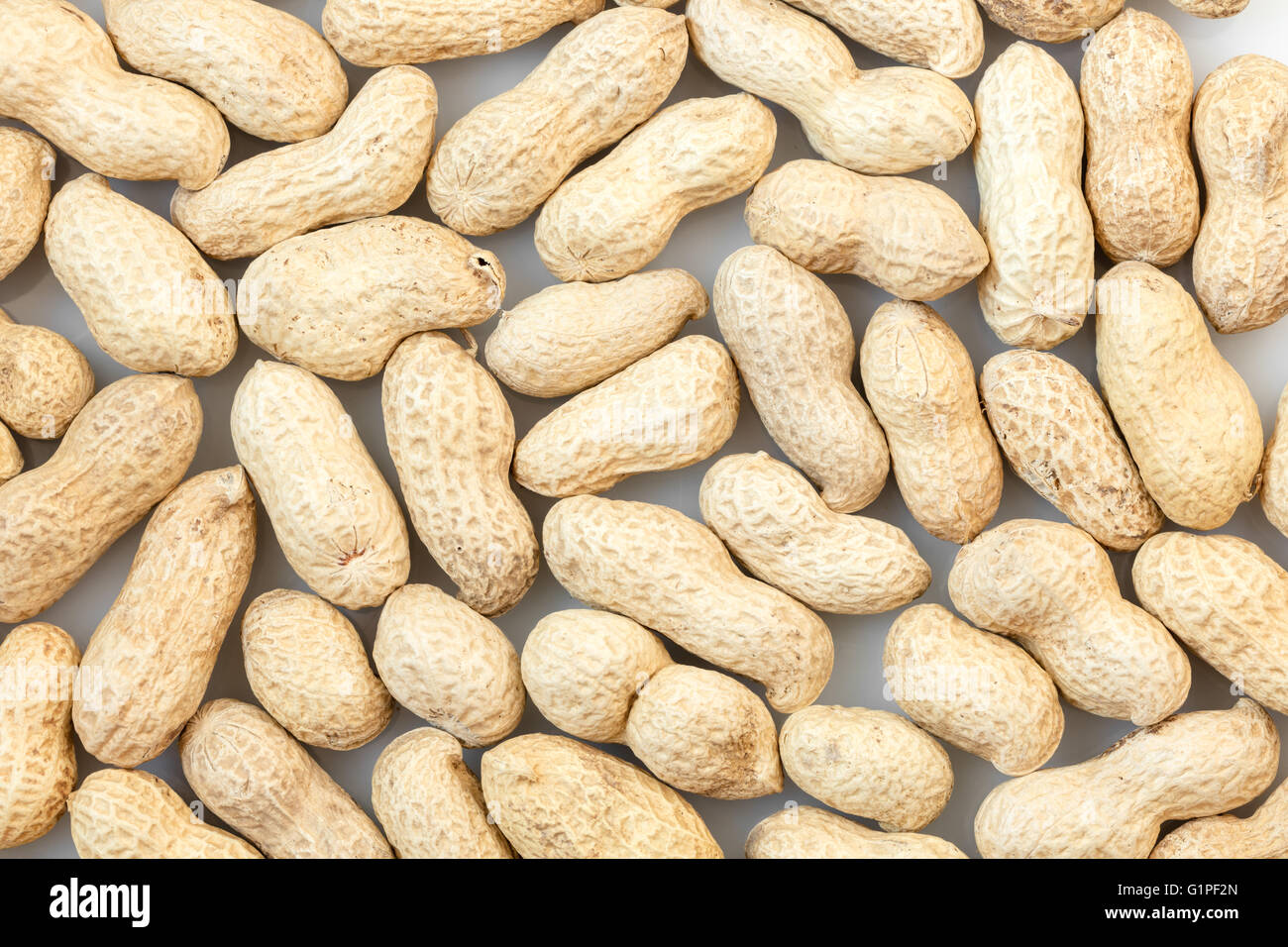 groundnut in the skin close-up on a white background Stock Photo - Alamy