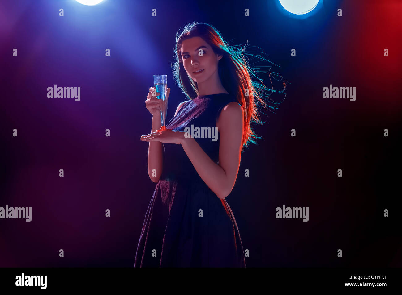 The beautiful girl dancing at the party drinking champagne Stock Photo ...