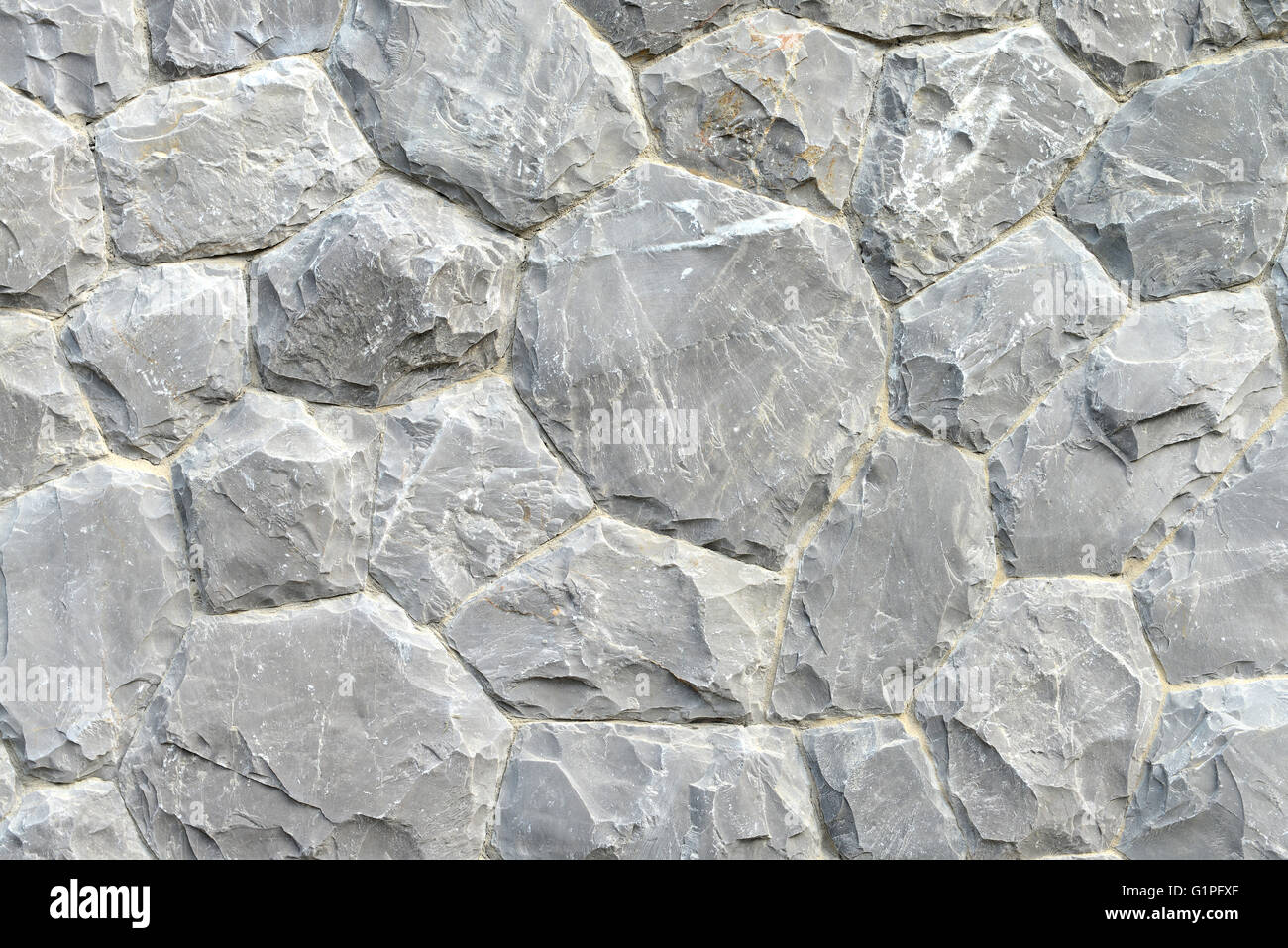 Gray stone wall texture and background Stock Photo - Alamy