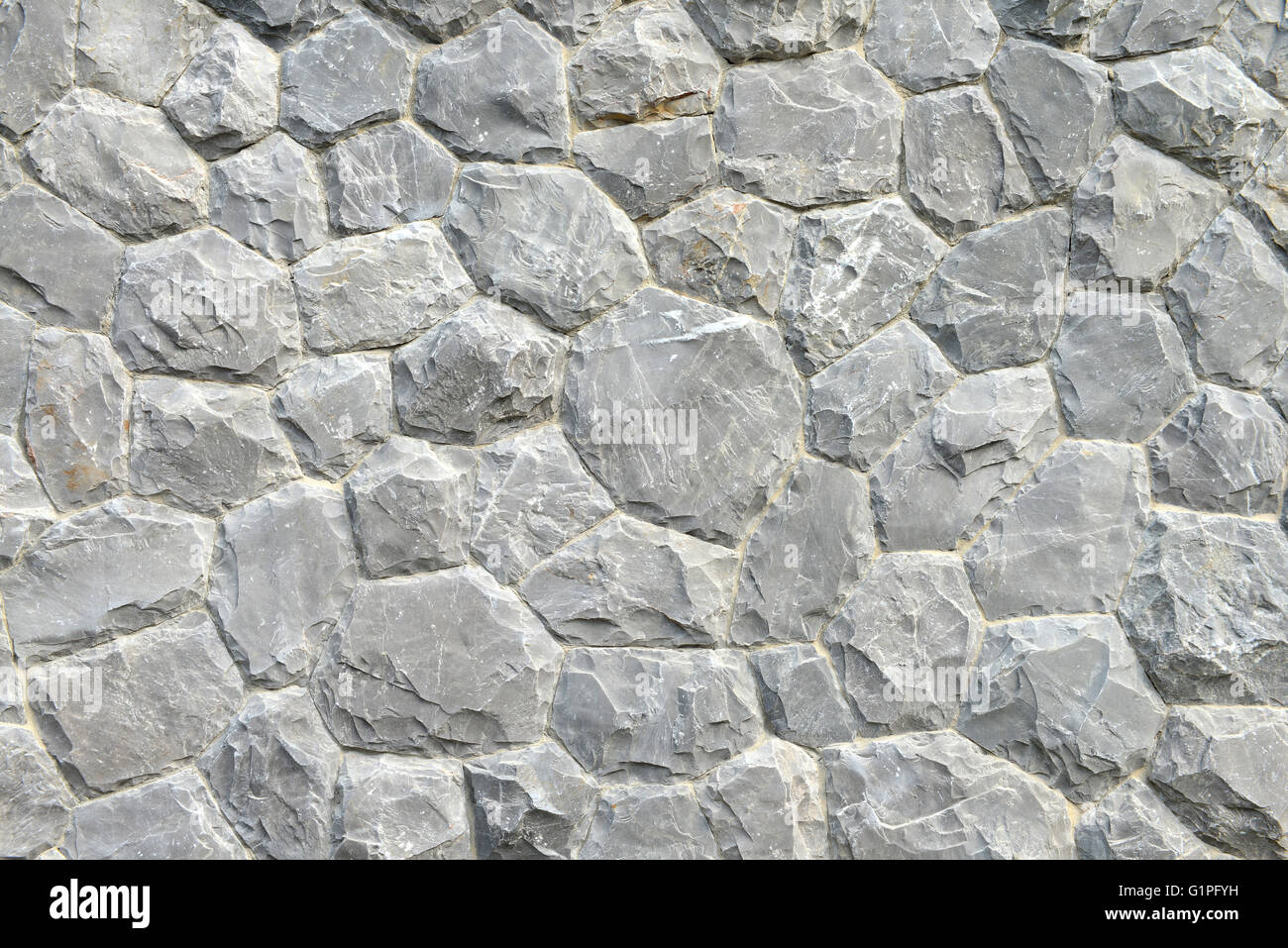 Gray stone wall texture and background Stock Photo - Alamy