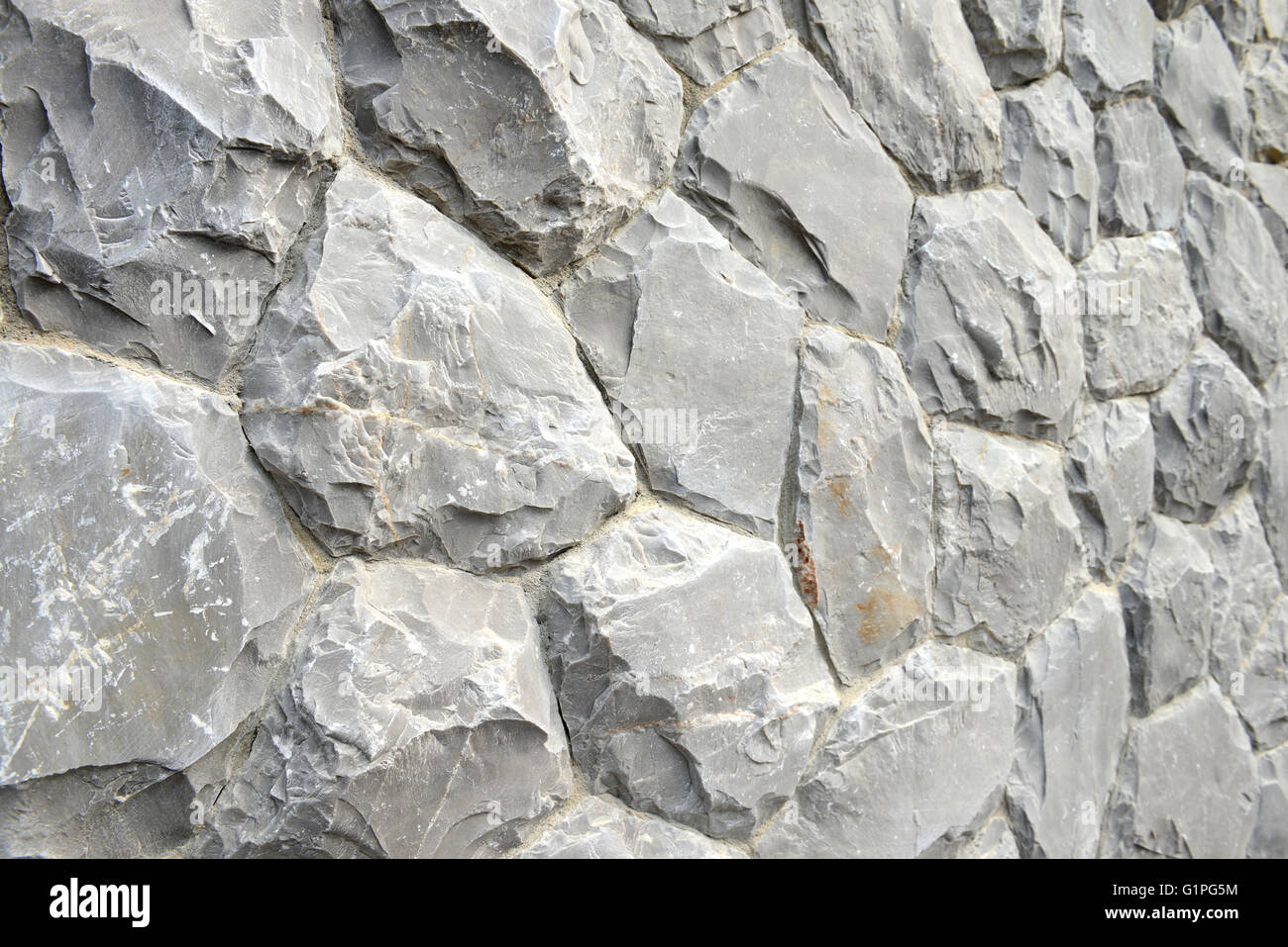 Gray stone wall texture and background Stock Photo - Alamy