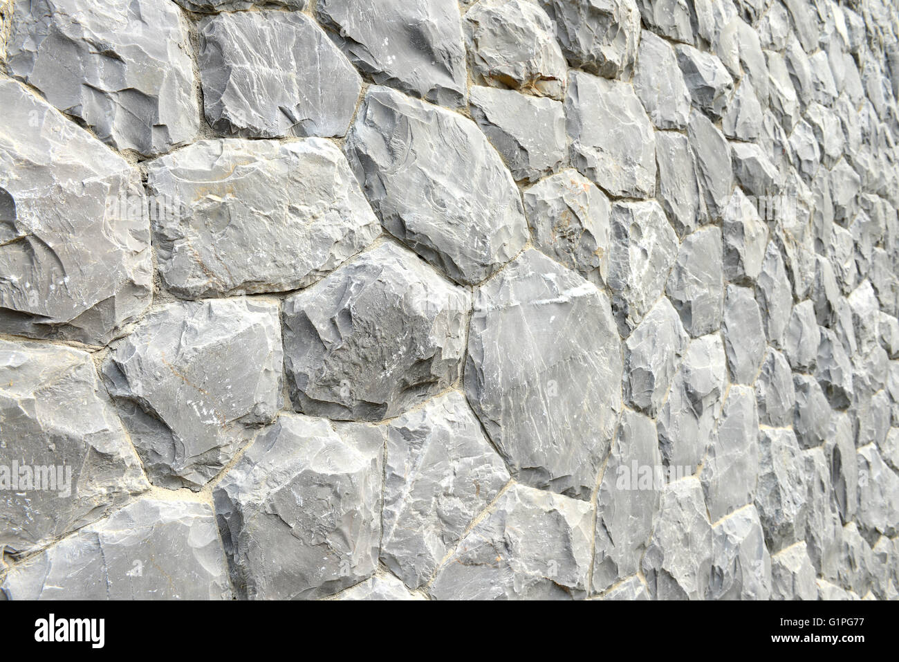 Gray stone wall texture and background Stock Photo - Alamy