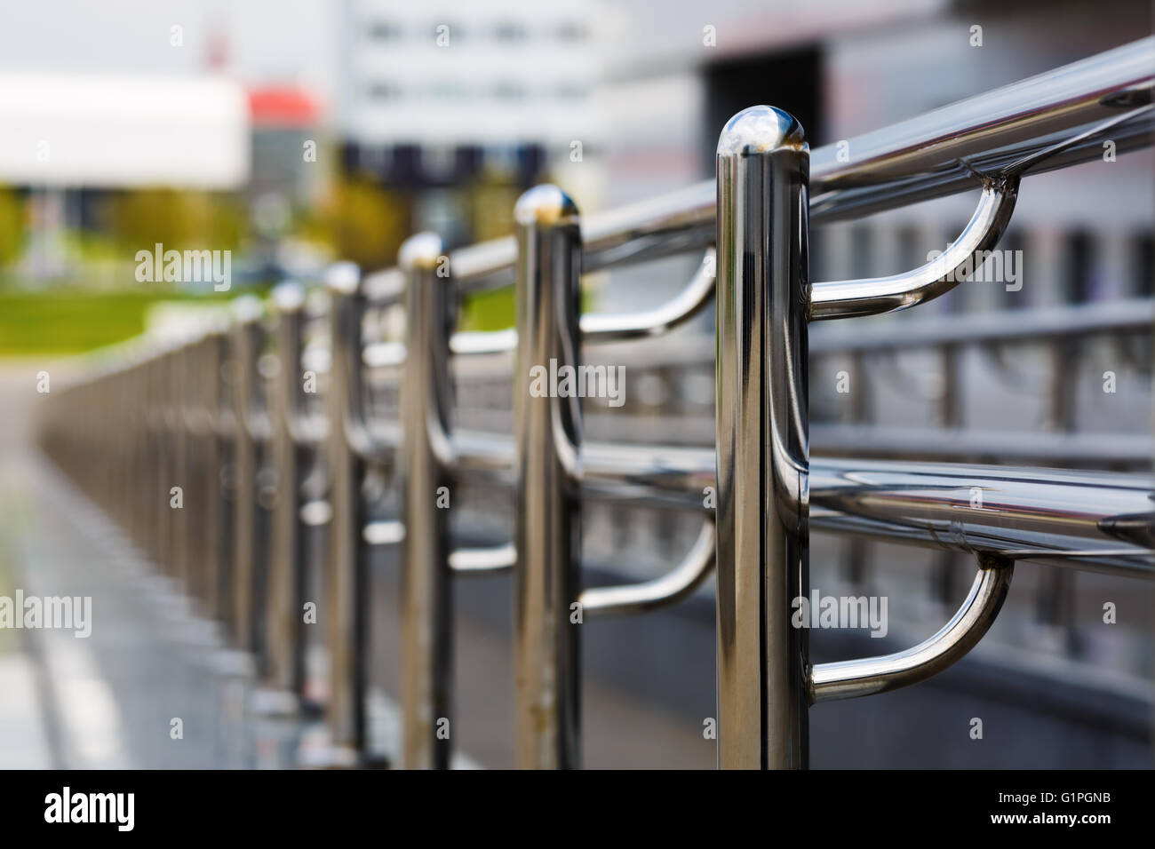 Chromium metal fence with handrail. Chrome-plated metal railings ...