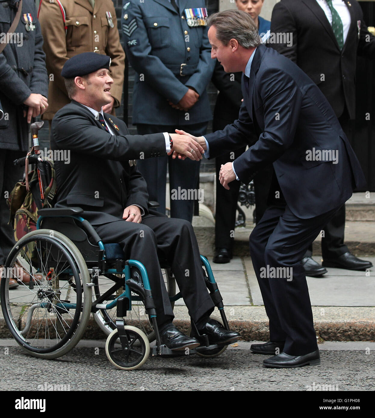 Prime Minister David Cameron buys his remembrance poppy from Corporal ...