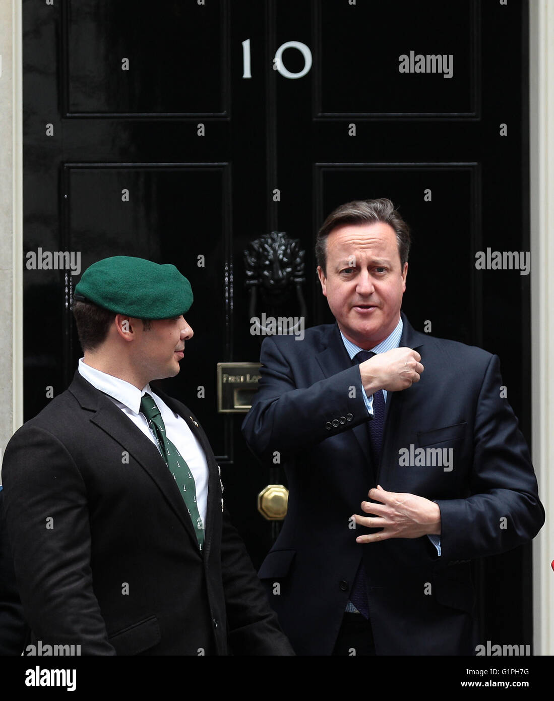 Prime Minister David Cameron buys his remembrance poppy from Corporal ...