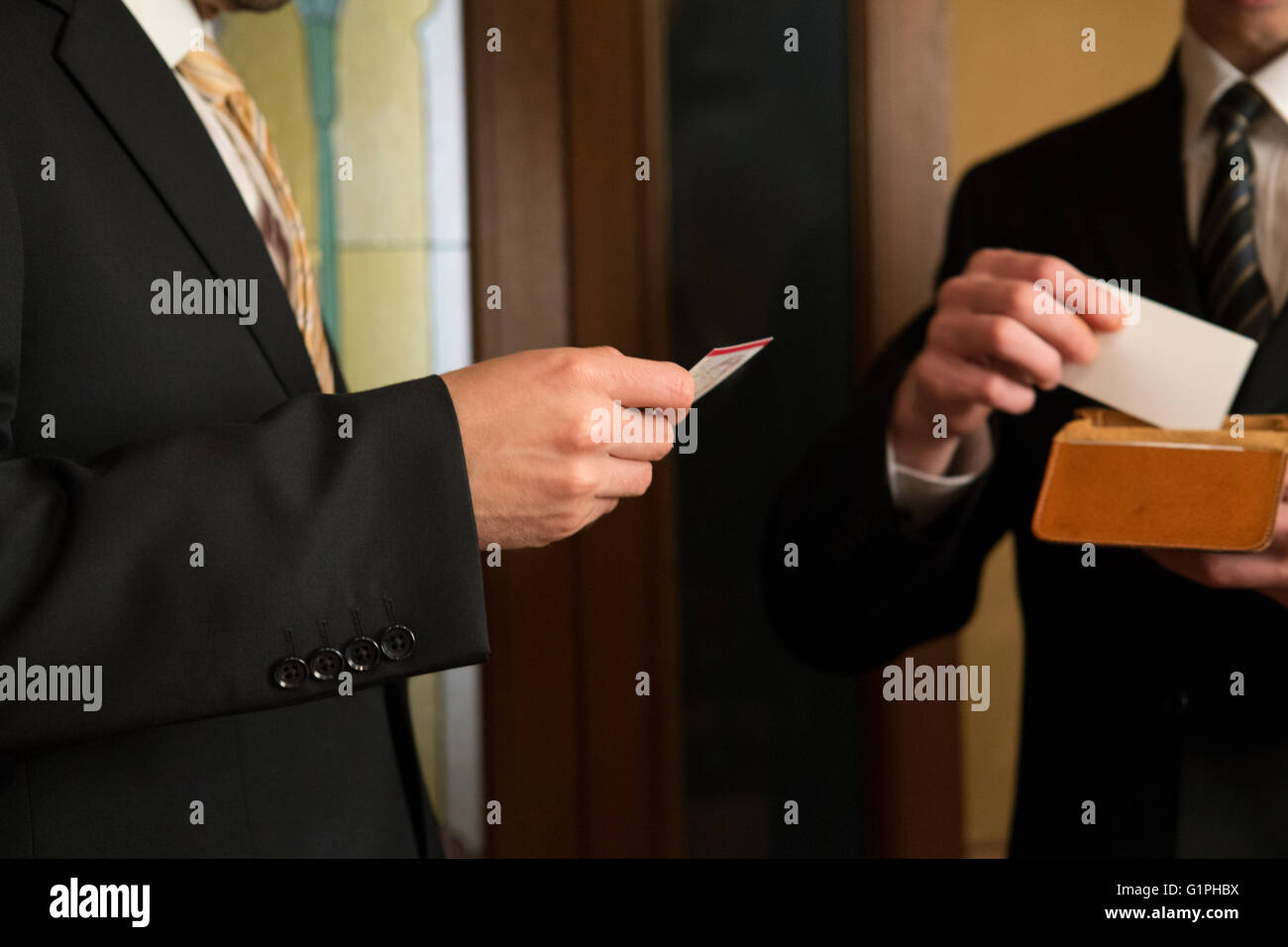 Exchanging business cards Stock Photo - Alamy