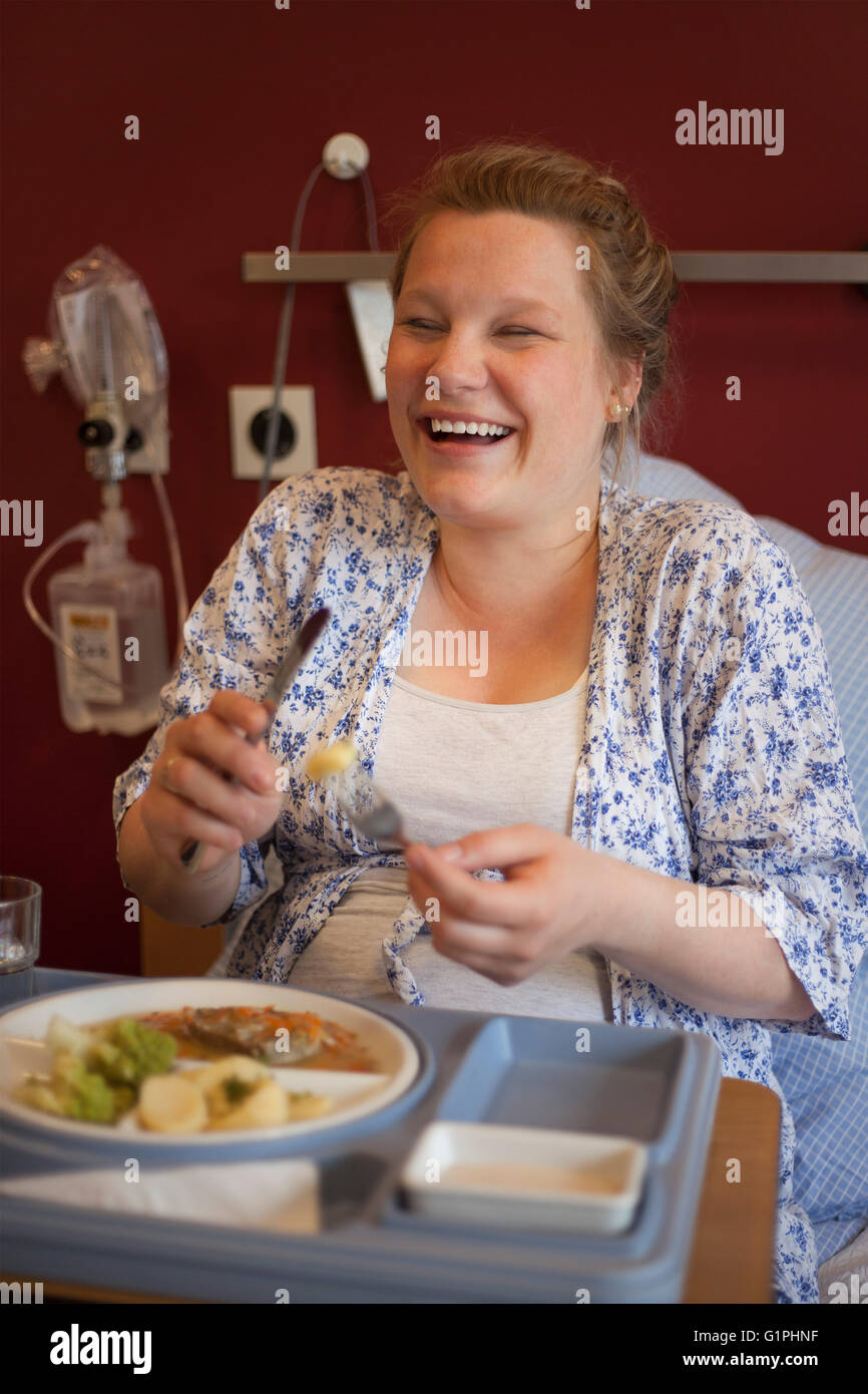 Pregnant woman in hospital eating Stock Photo - Alamy