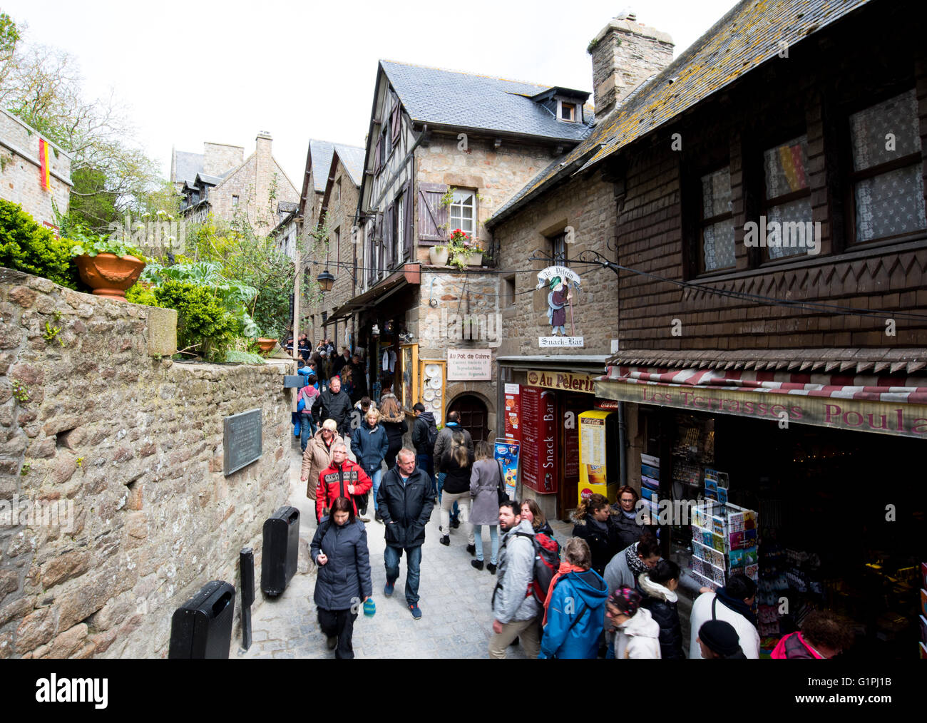 Tourists in Grande Rue, main street of Mont Saint Michel, Normandy ...