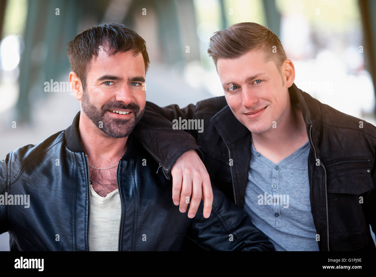 Two male friends hugging and laughing hi-res stock photography and ...