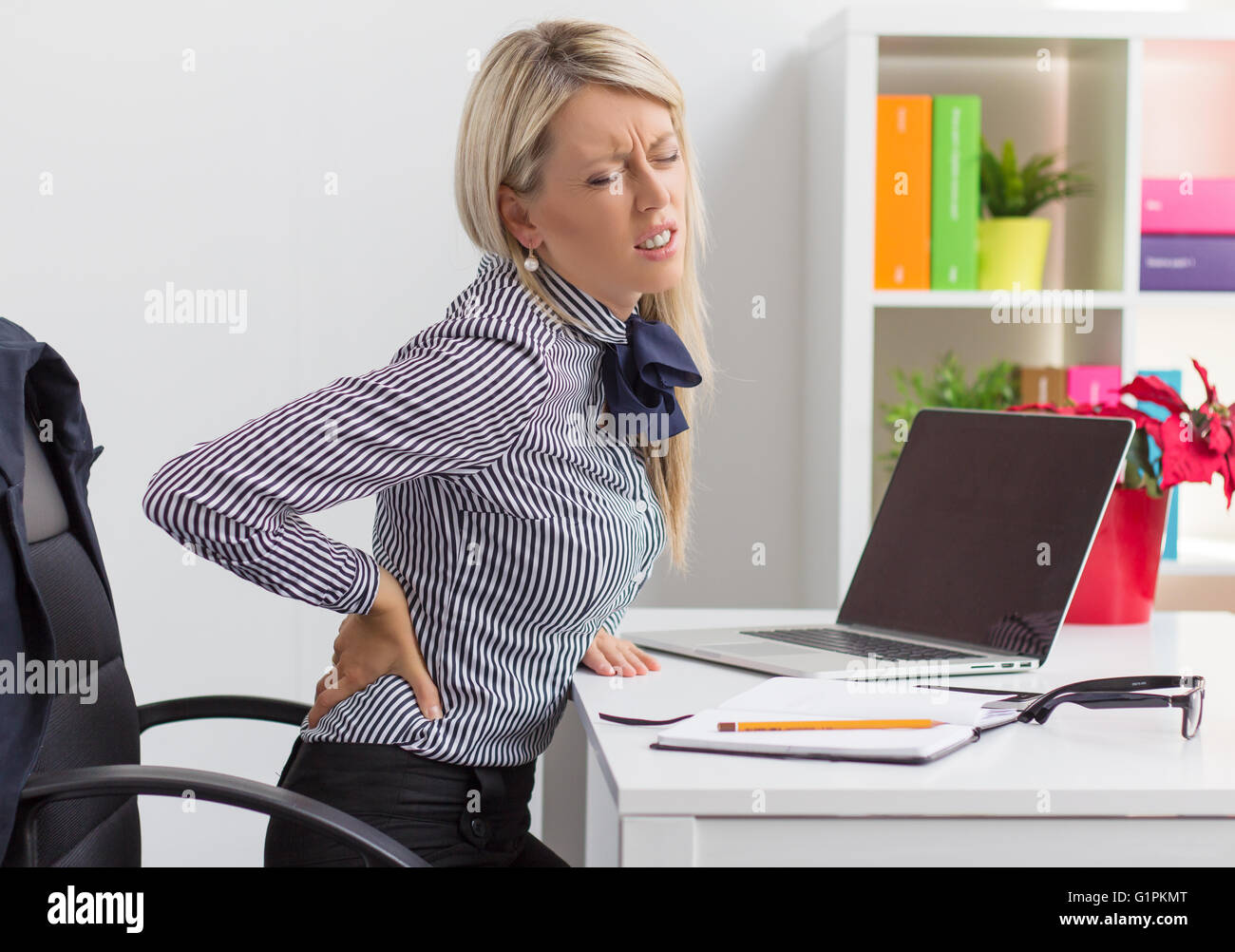 Woman back ache office desk hi-res stock photography and images - Alamy