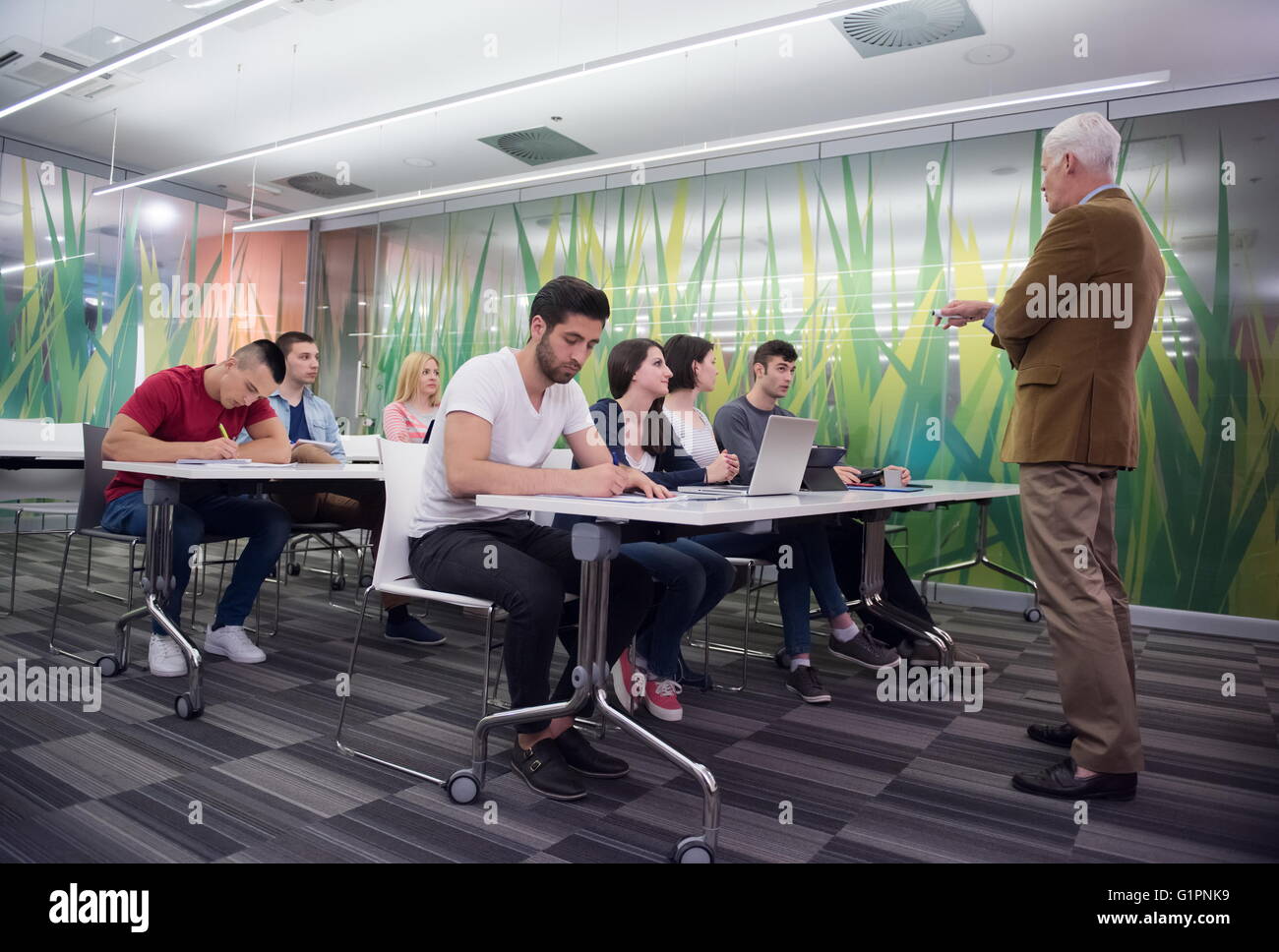 group of students study with professor in modern school classroom Stock ...