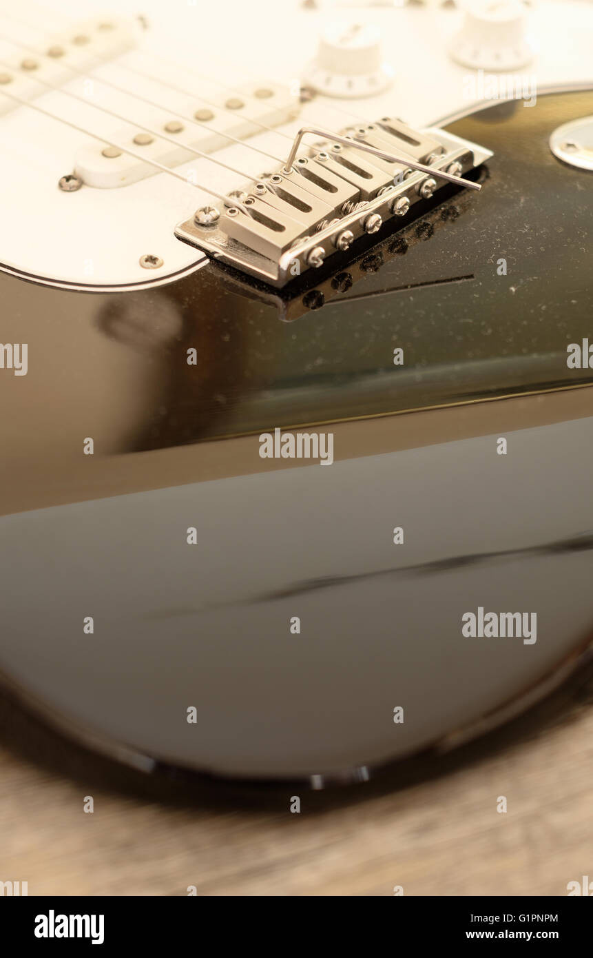 Hand close-up tuning a vintage electric guitar Stock Photo - Alamy