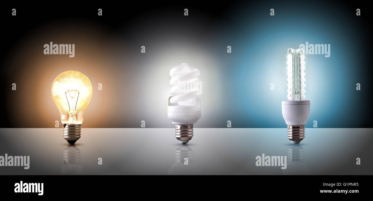 Comparison between various types of light bulb on black background ...
