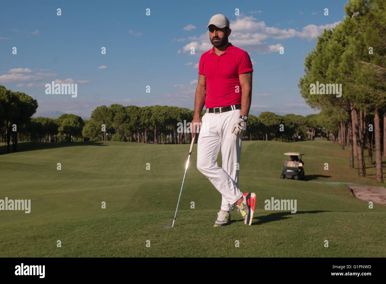 handsome middle eastern golf player portrait at course on beautiful ...