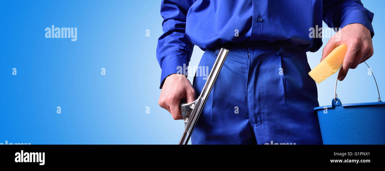Window cleaning employee with work tools and blue background ...