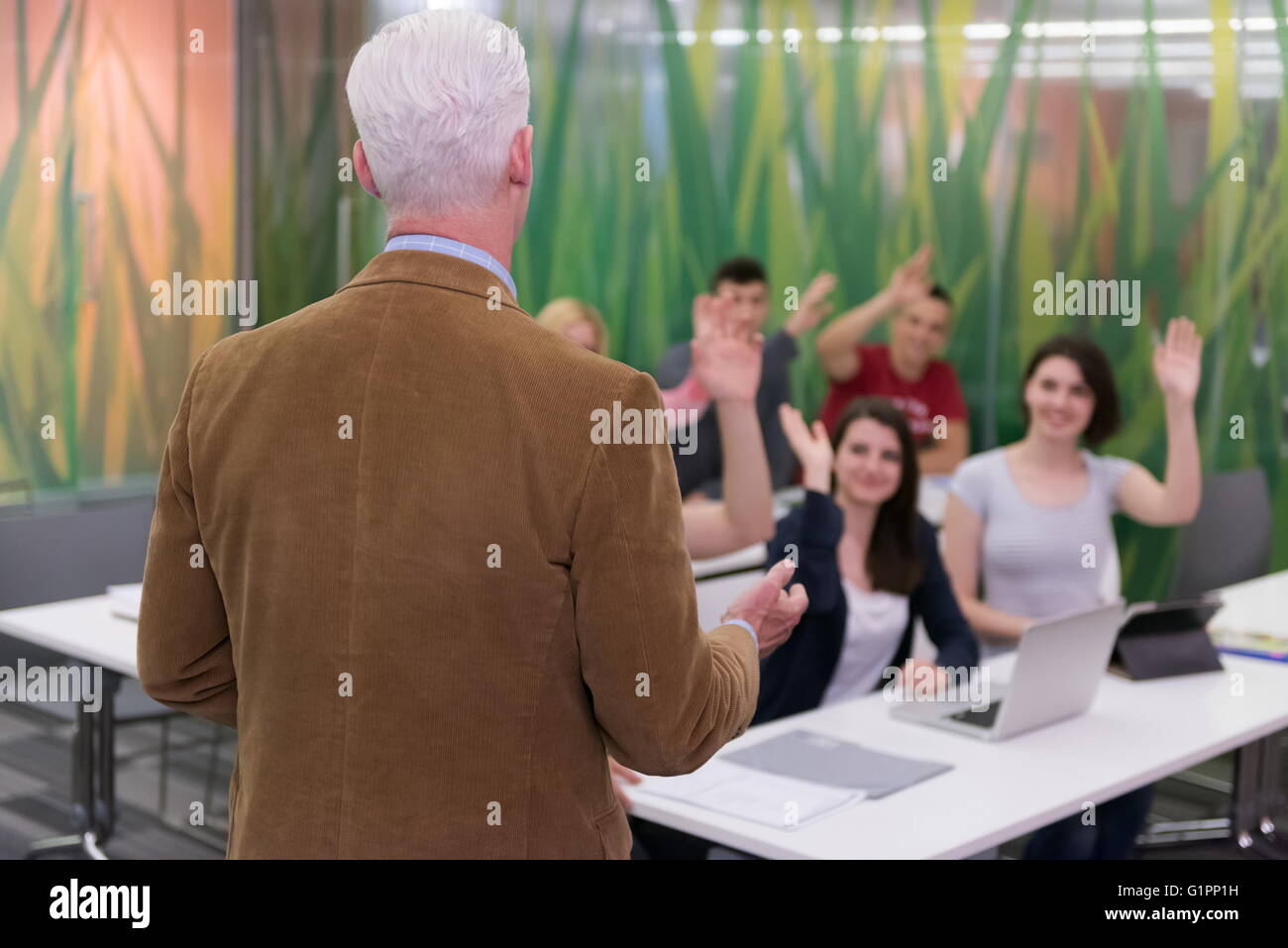 group of students study with professor in modern school classroom Stock ...