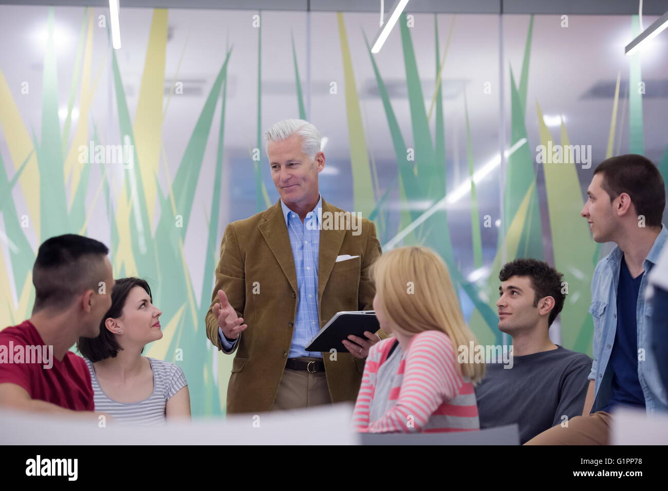group of students study with professor in modern school classroom Stock ...