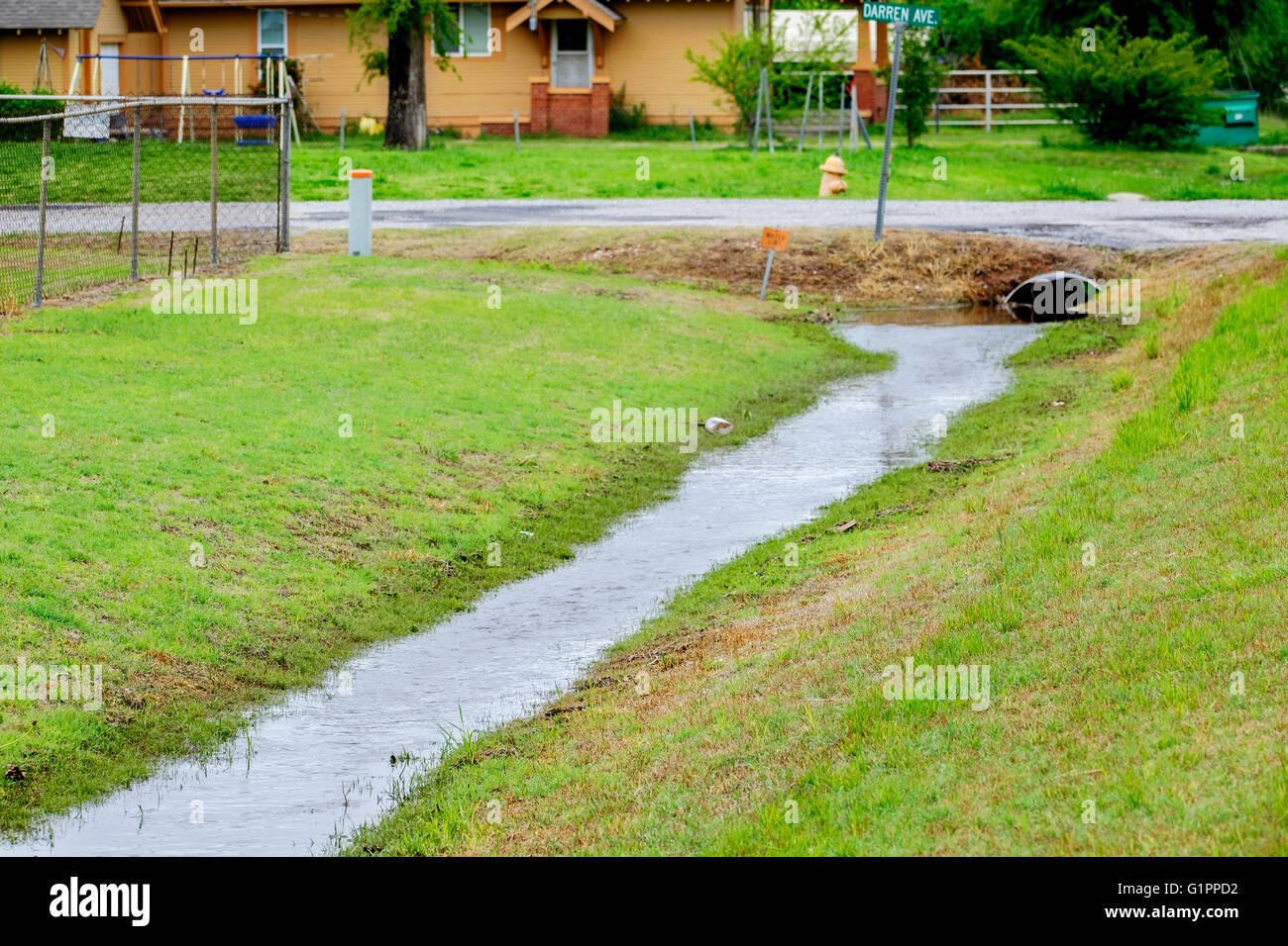 Rainwater in a ditch flows into a drain in Oklahoma, USA Stock Photo ...
