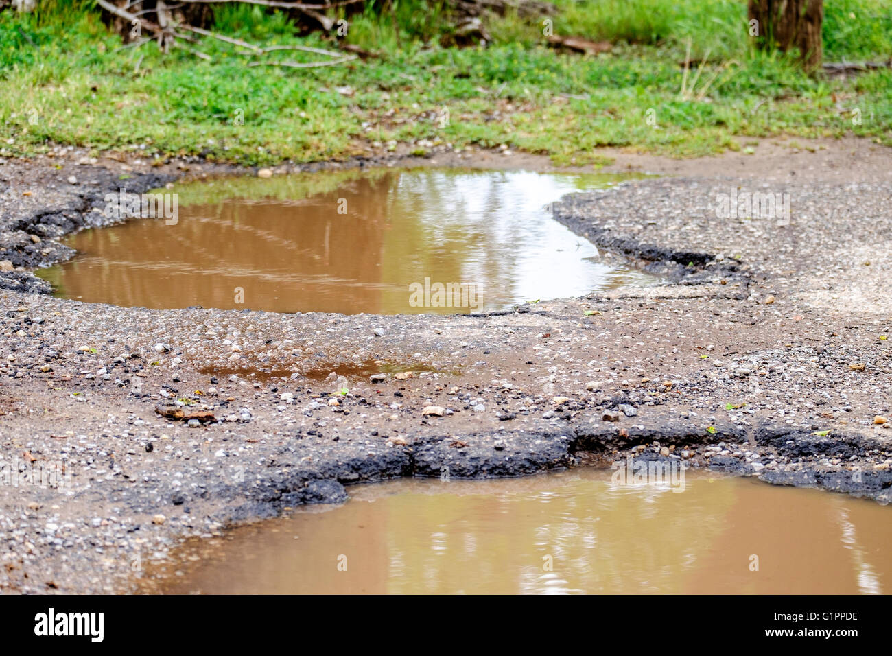 Holes on asphalt road hi-res stock photography and images - Alamy