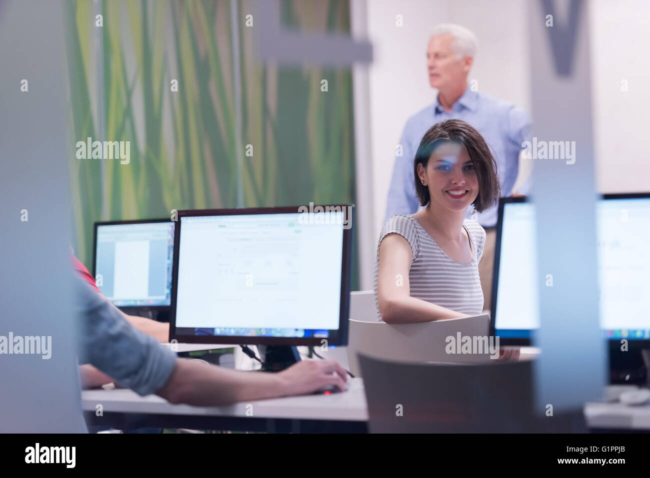 technology students group in computer lab school classroom working on ...