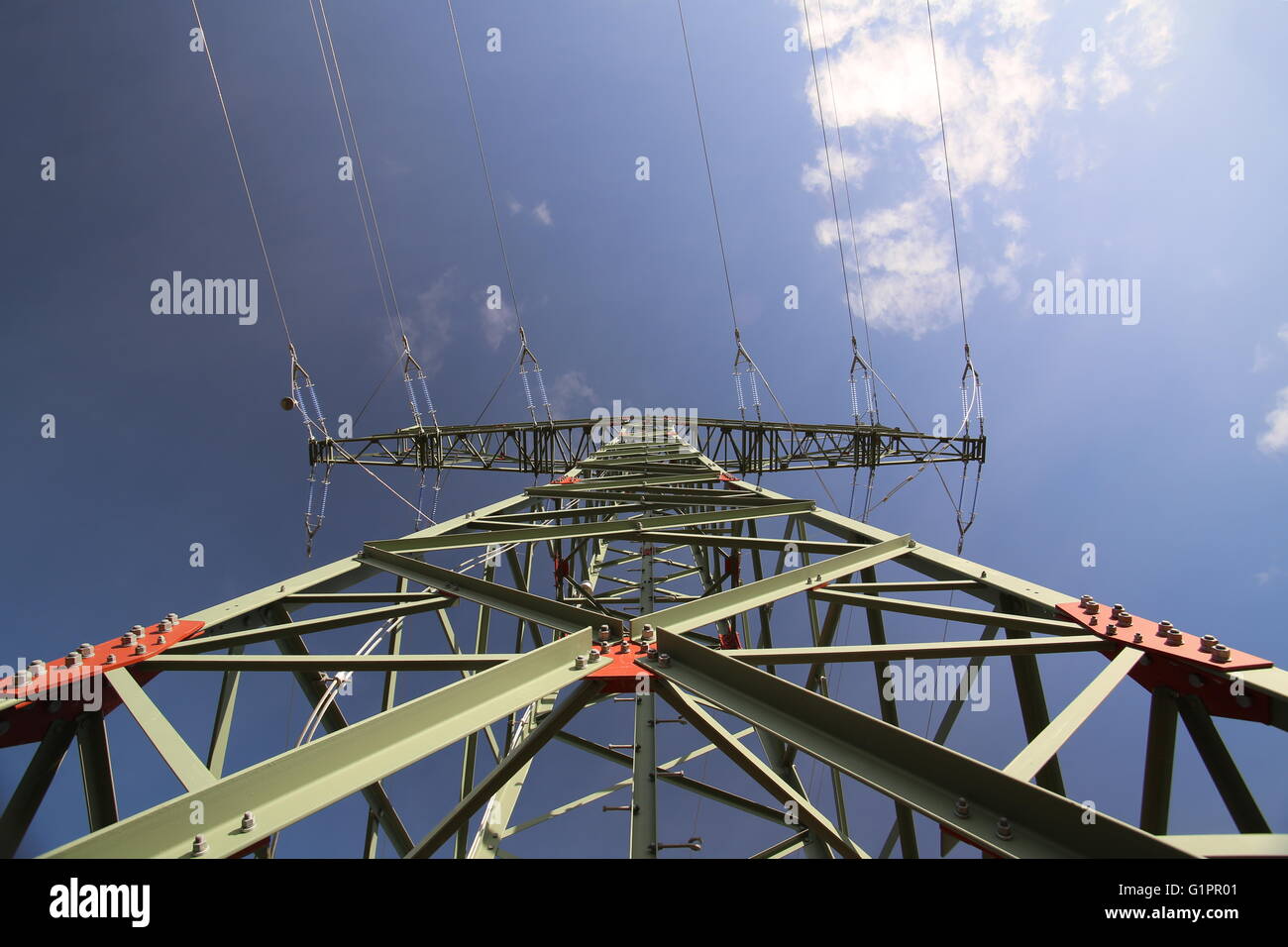 Wide angle view of a high voltage line pylon and dark blue sky from ...