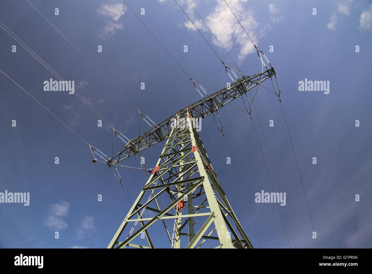 View of a high voltage line pylon and dark blue sky from below Stock ...