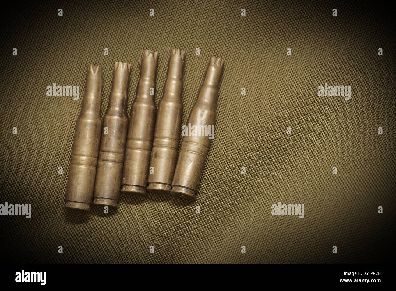 Bullet casings on textile with sepia effect and vignetting Stock Photo ...