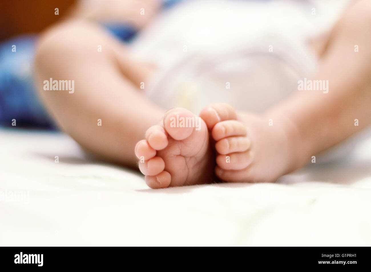 Newborn feet hi-res stock photography and images - Alamy