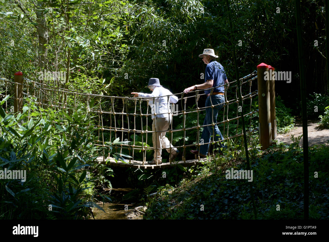 Man crossing rope bridge in hi-res stock photography and images - Alamy