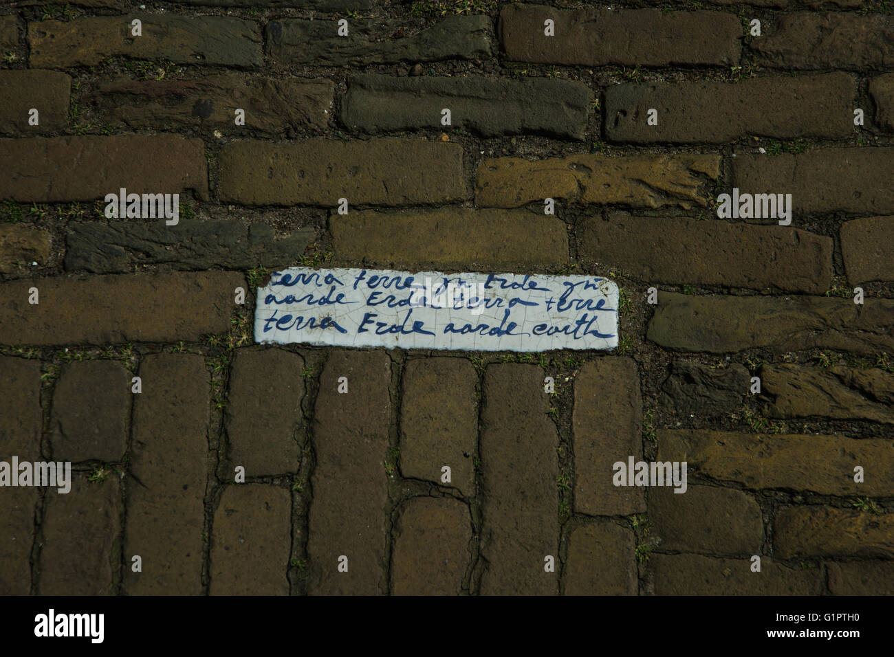 Ceramic tiles set into the cobbles in Delft Stock Photo - Alamy