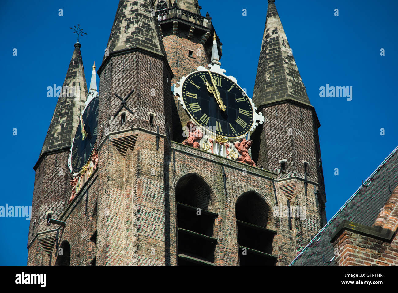 Clock tower of the Oude Kerk in Delft Stock Photo - Alamy