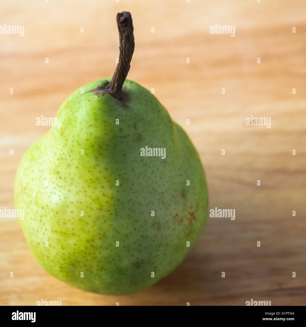 One Green Pear Stock Photo - Alamy