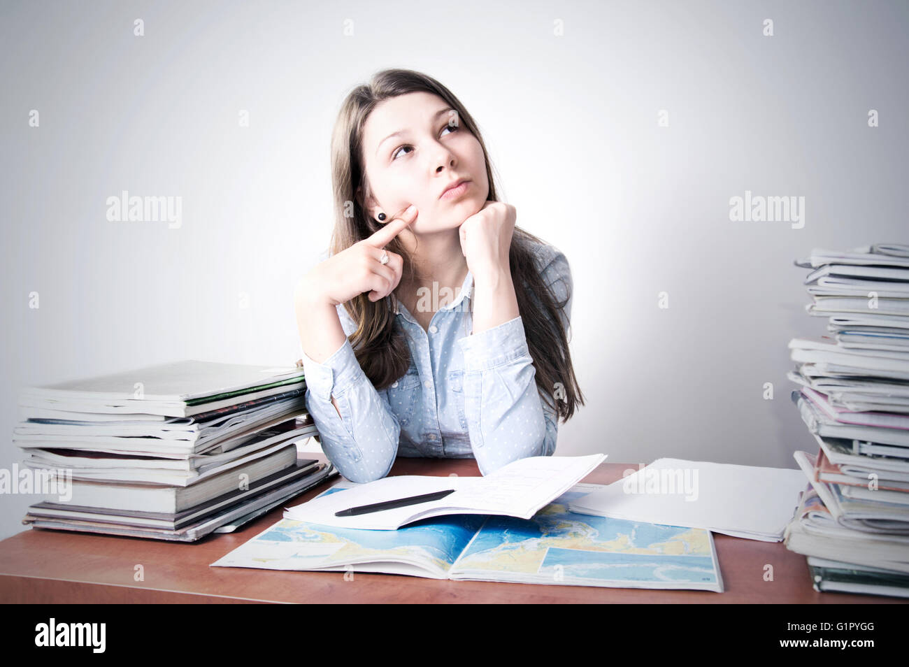 Cute smart young girl studying. Education conceptual image Stock Photo ...