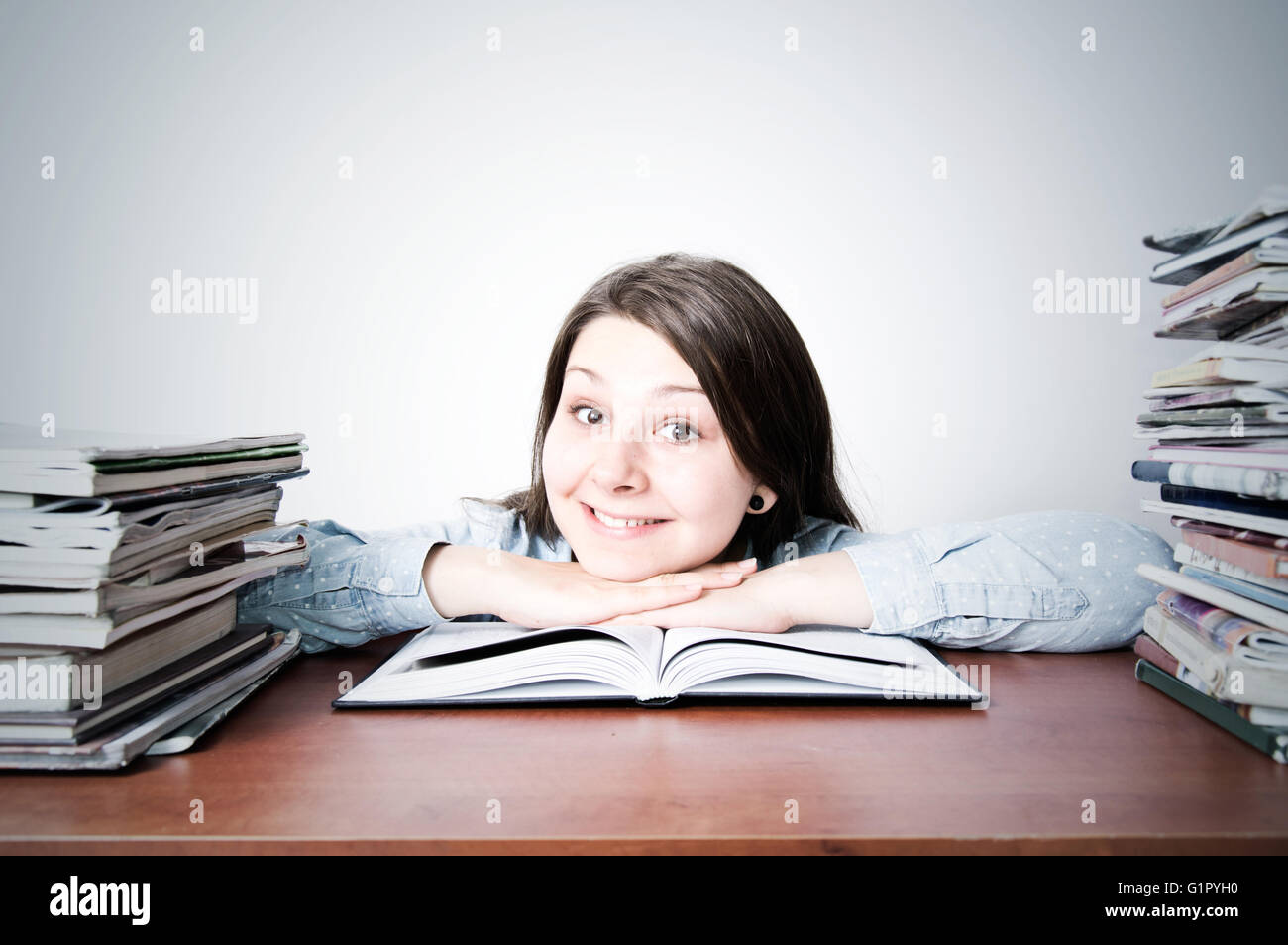 Cute smart young girl studying. Education conceptual image Stock Photo ...