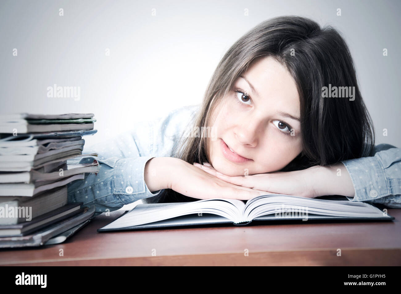 Cute smart young girl studying. Education conceptual image Stock Photo ...