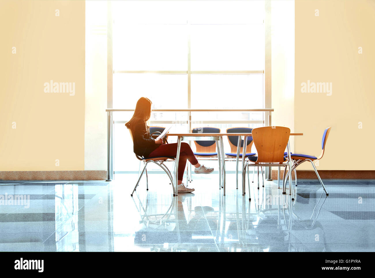 Pretty young student girl studying in the university. Education ...