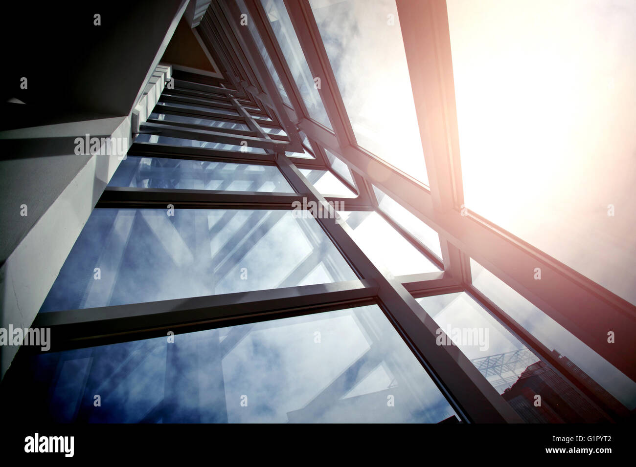 Modern business architecture and sunny sky. Construction with windows ...