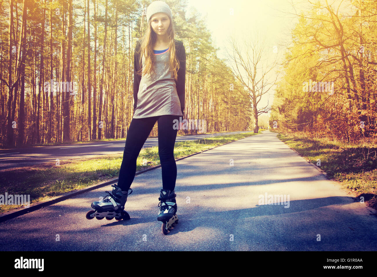 Teenage girl on roller skates at summer. Inline skates sport conceptual ...